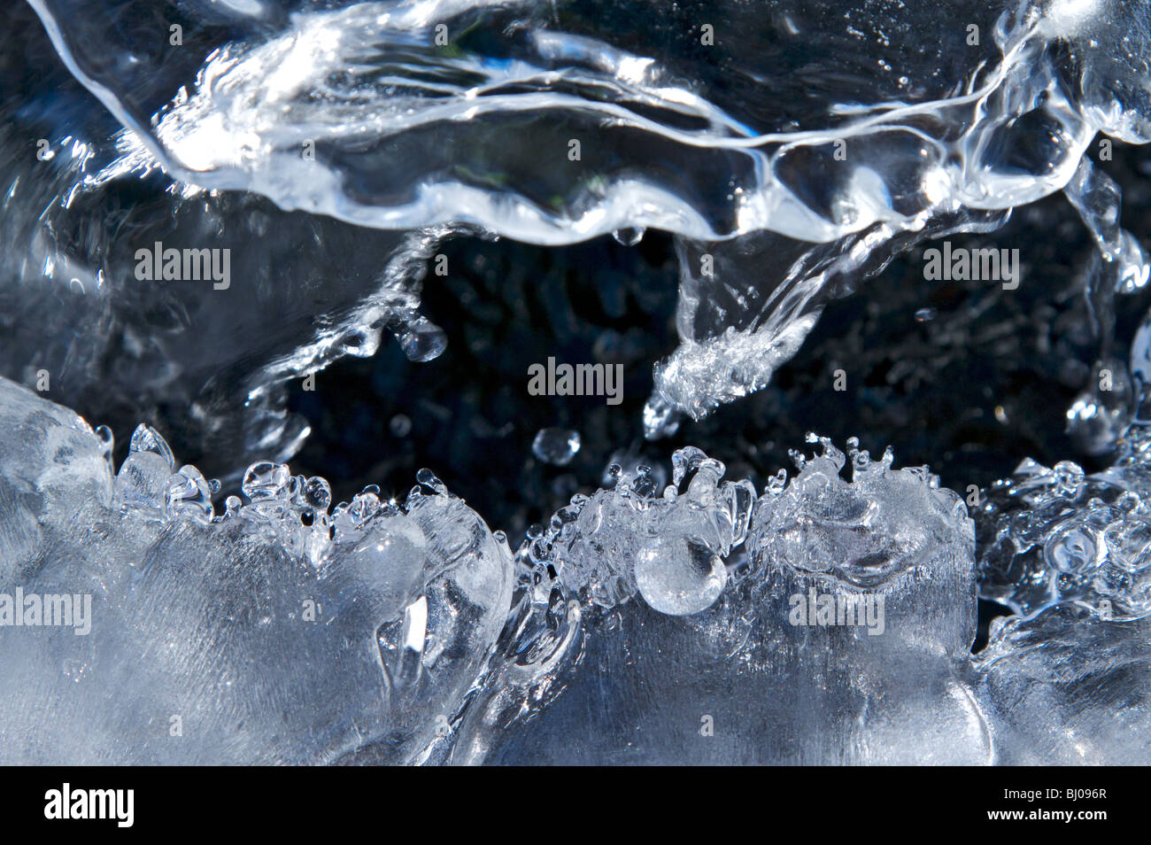 ice shapes formed from water flowing from pump in garden pond Stock ...