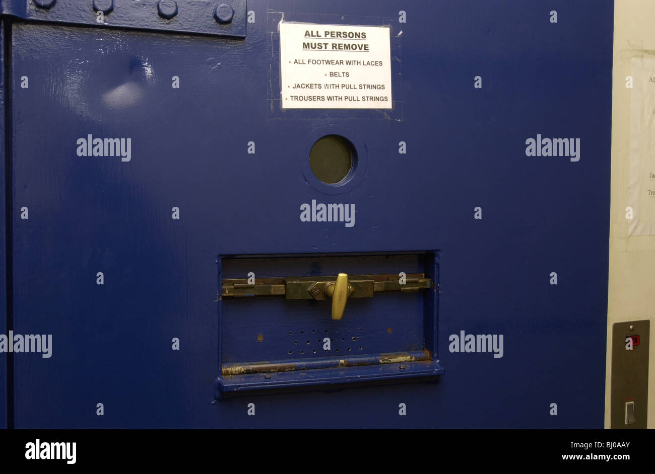 Police cell door showing instructions for inmates UK Stock Photo - Alamy