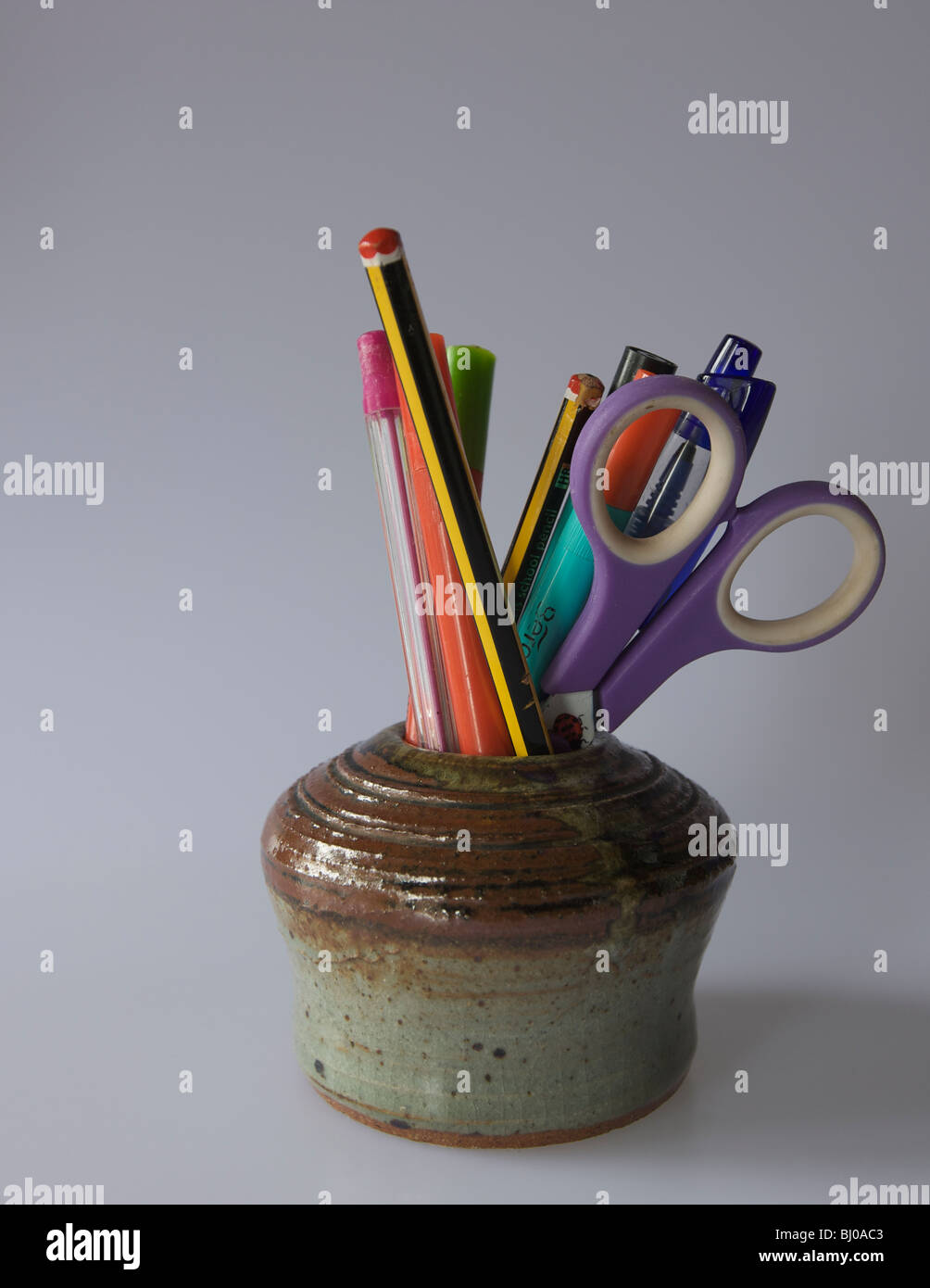 pencils, pens and scissors in a pot Stock Photo - Alamy