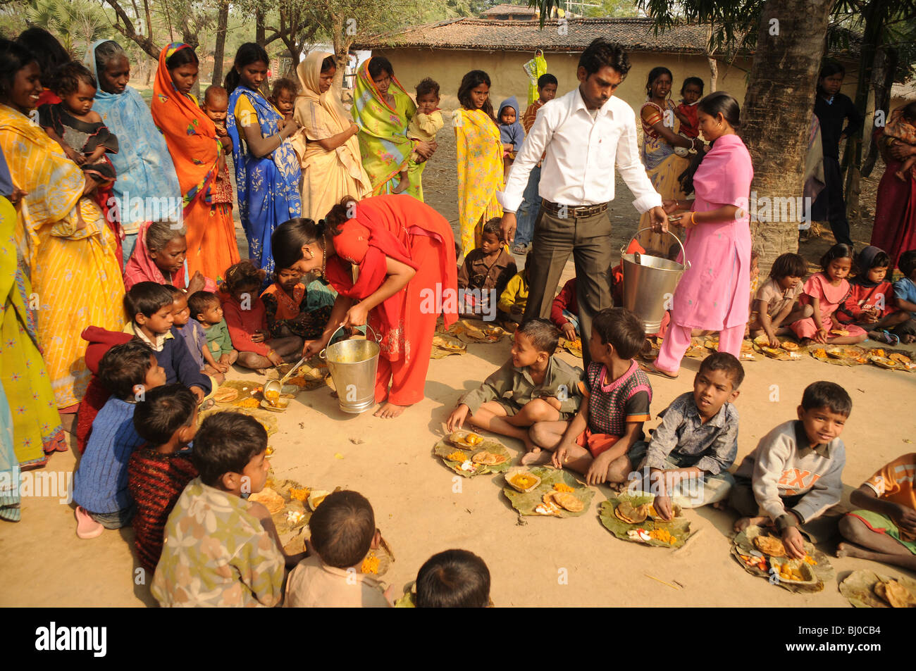children enjoy a celebratory feast together sharing their food and ...