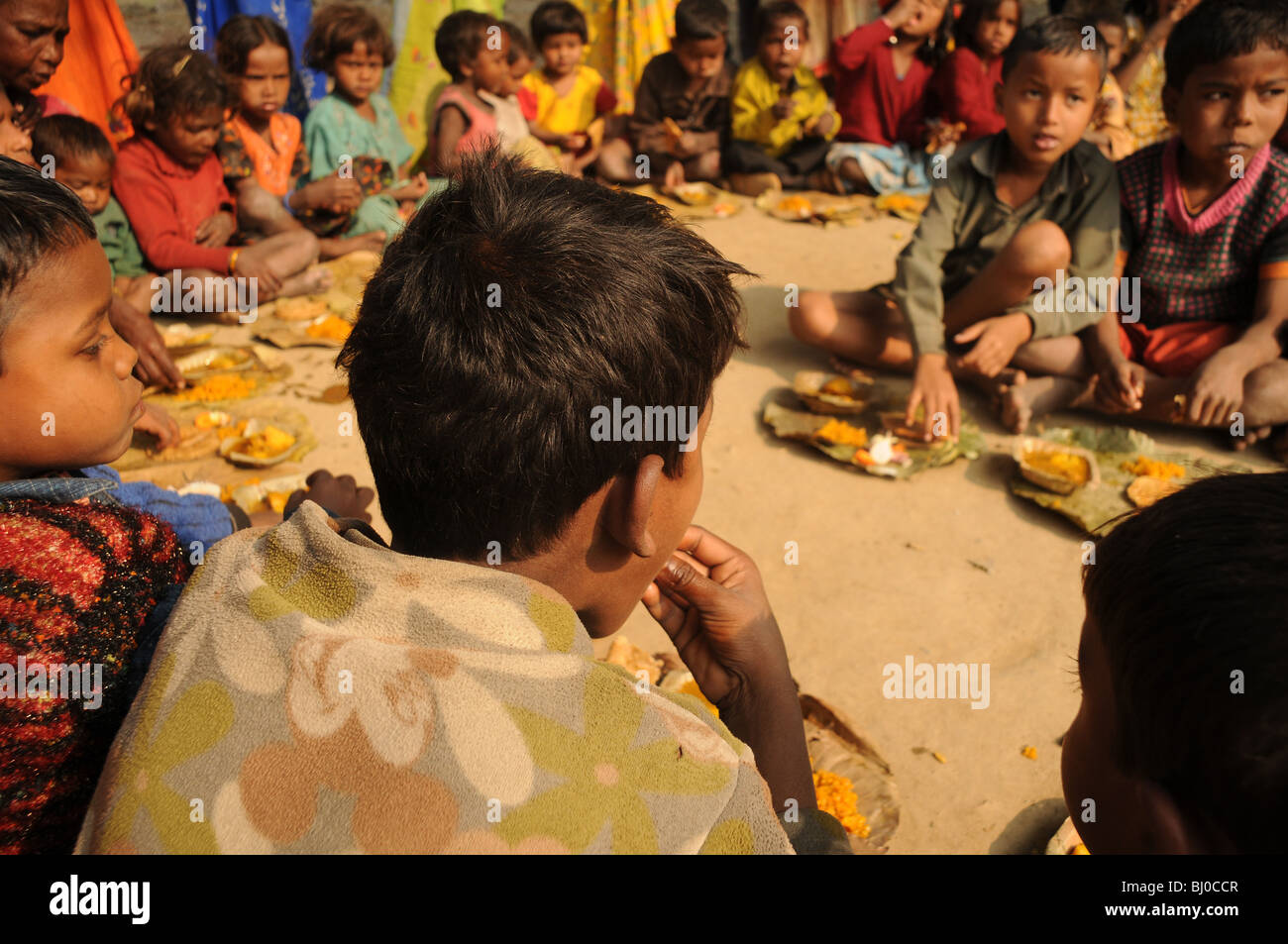 children enjoy a celebratory feast together sharing their food and ...