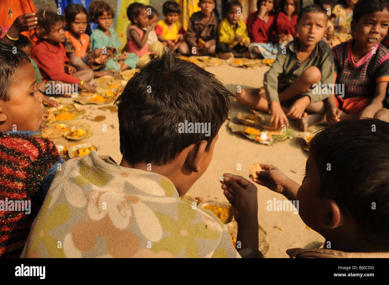 children enjoy a celebratory feast together sharing their food and ...