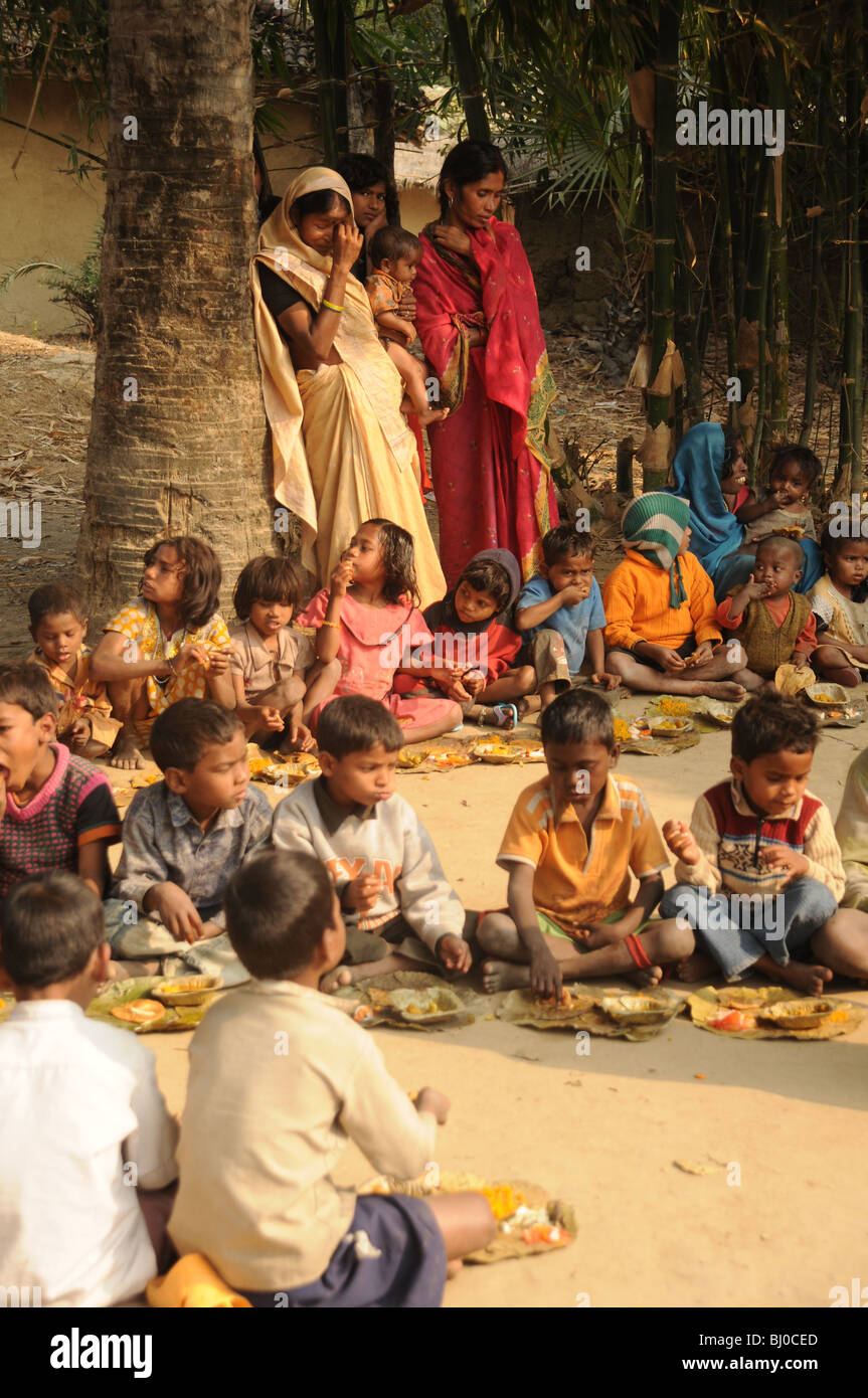 children enjoy a celebratory feast together sharing their food and ...