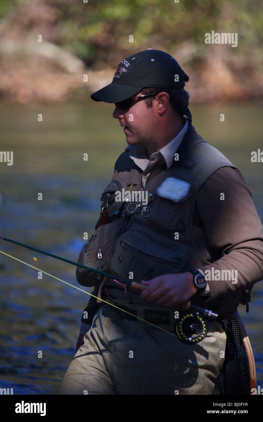 FLY FISHERMAN FISHING IN FAST RUNNING RIVER IN SEARCH OF TROUT TOCCOA ...
