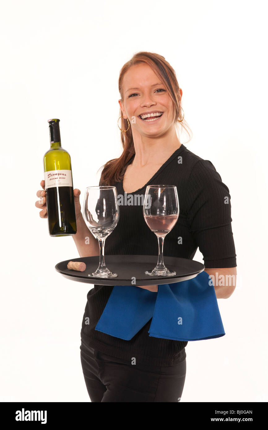 A pleasant smiling waitress greets you with wine Stock Photo - Alamy