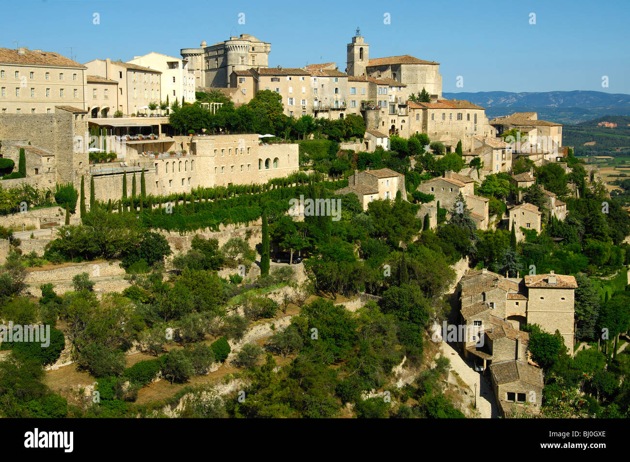 Gordes with the Château de Gordes and the Saint-Firmin church on the ...