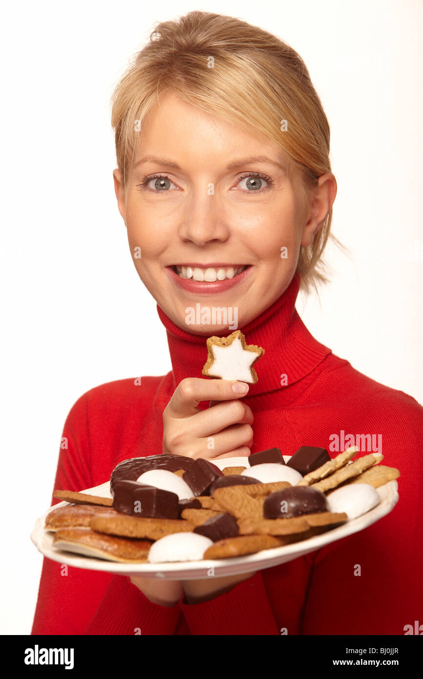 Woman eating christmas cookies hi-res stock photography and images - Alamy