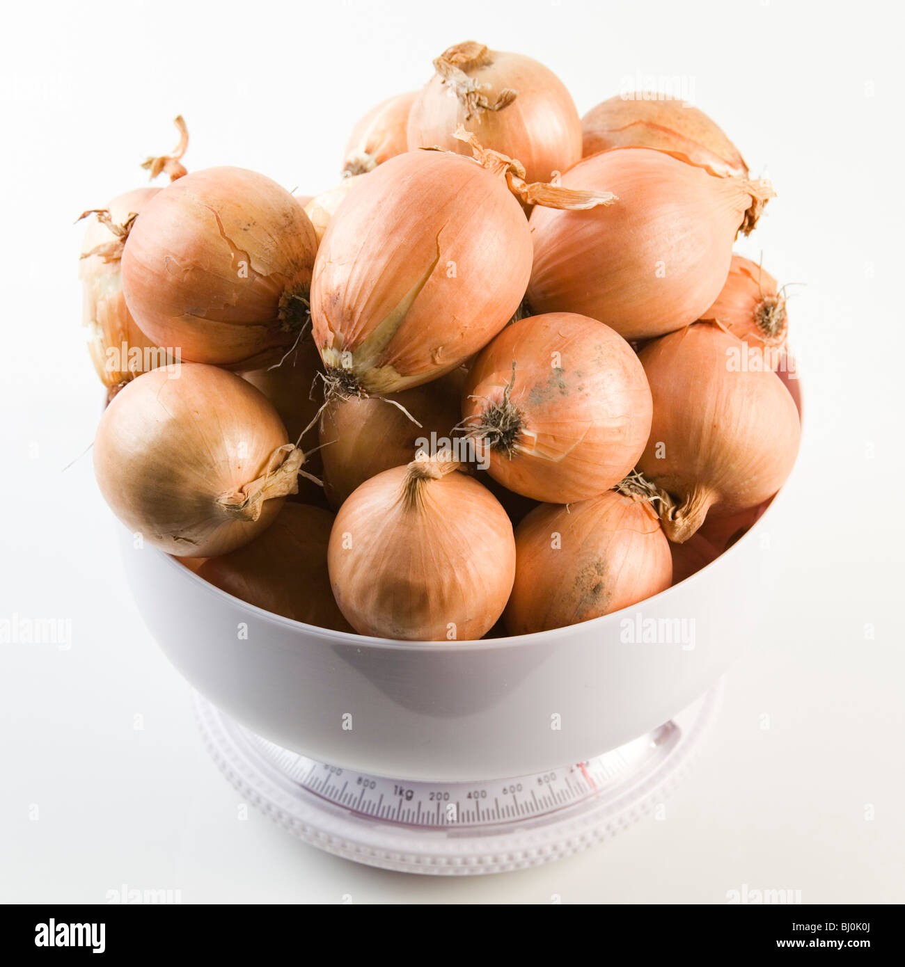 onions in a kitchen scale Stock Photo - Alamy