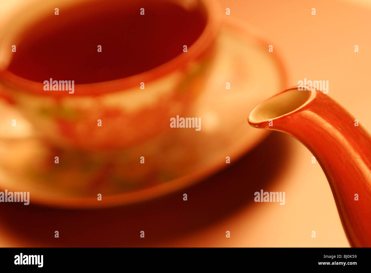 tea can with tea cup Stock Photo - Alamy