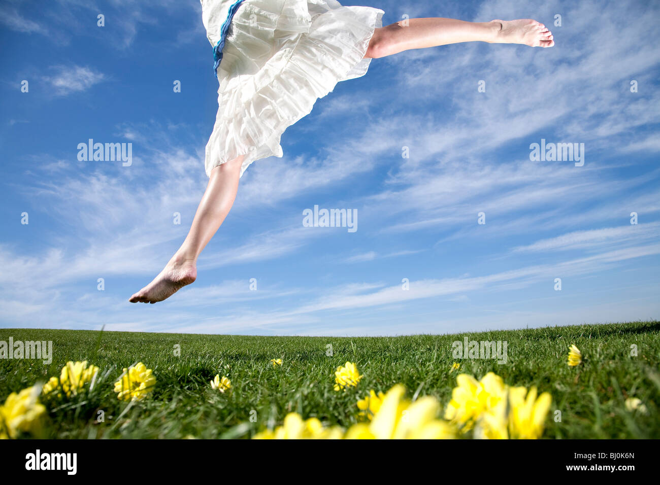 Woman jumping on flower hi-res stock photography and images - Alamy