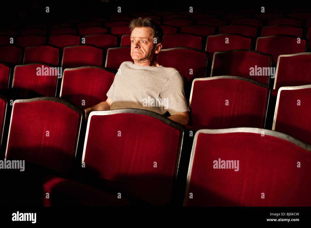 portrait of spectator watching theatre play Stock Photo - Alamy