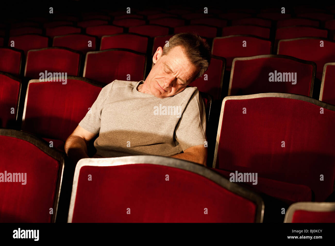 portrait of spectator watching theatre play Stock Photo - Alamy