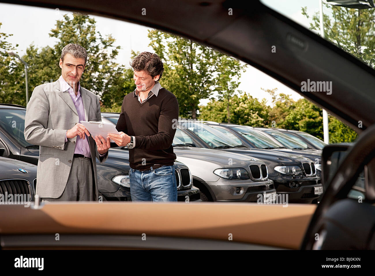 Car sales person signing hi-res stock photography and images - Alamy