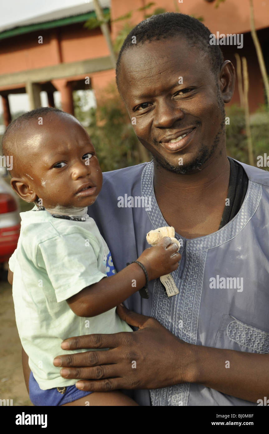 Father with his child, The Gambia Stock Photo - Alamy