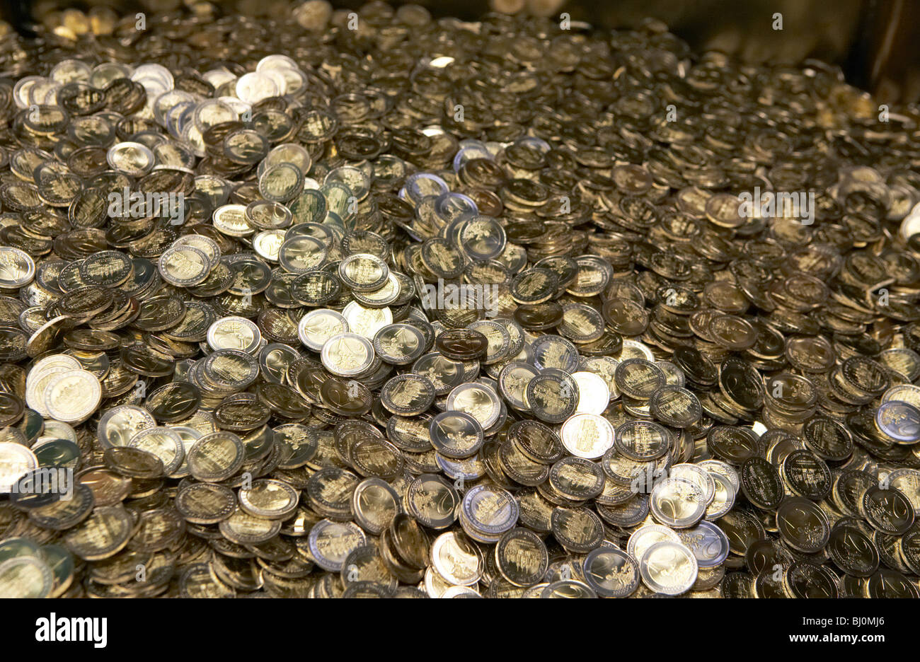 Newly minted 2 Euro coins in the State Mint Berlin, Germany Stock Photo ...
