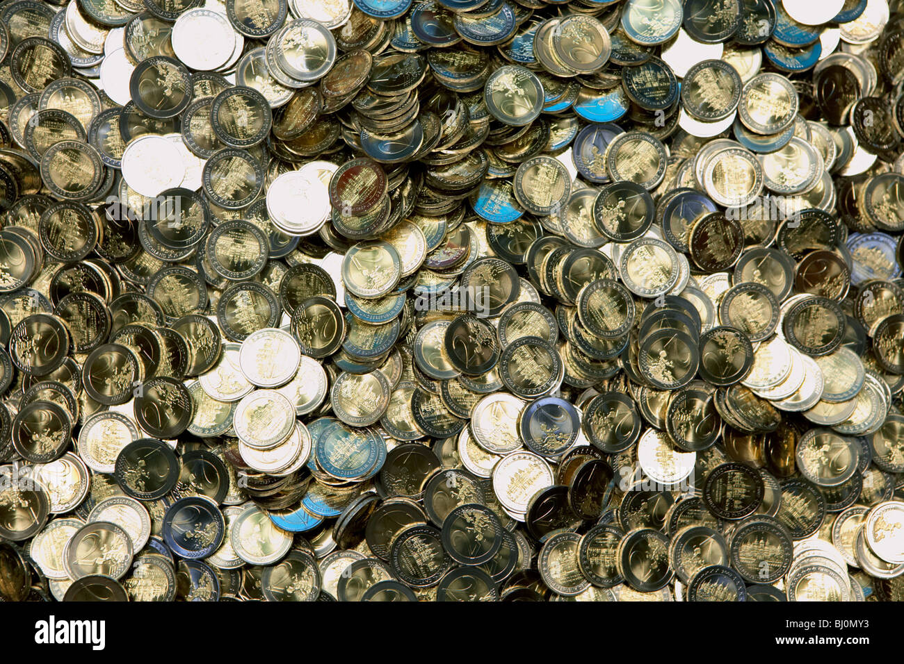Newly minted 2 Euro coins in the State Mint Berlin, Germany Stock Photo ...