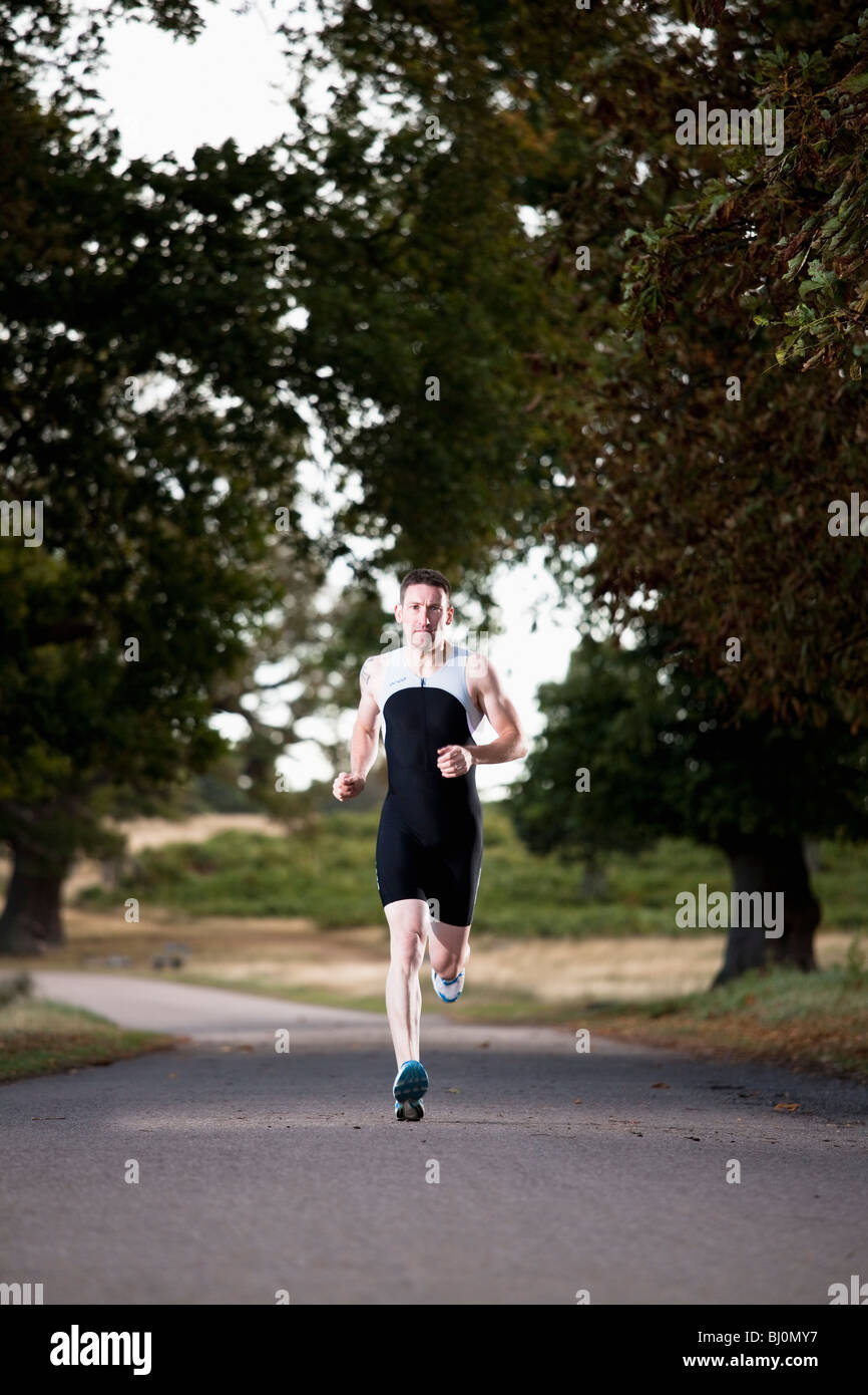 man running on road Stock Photo - Alamy