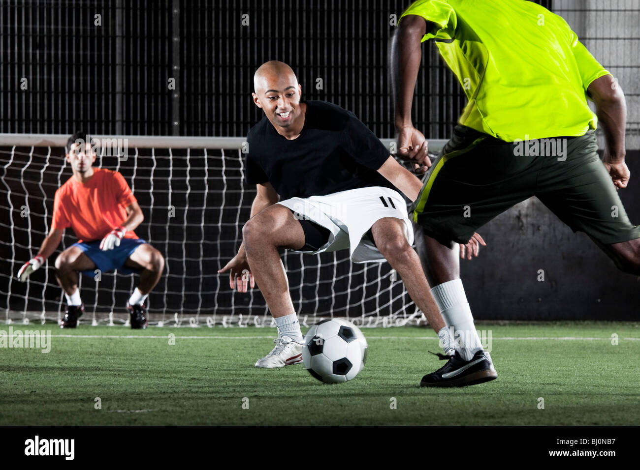 scene in street football match player defending goal Stock Photo - Alamy