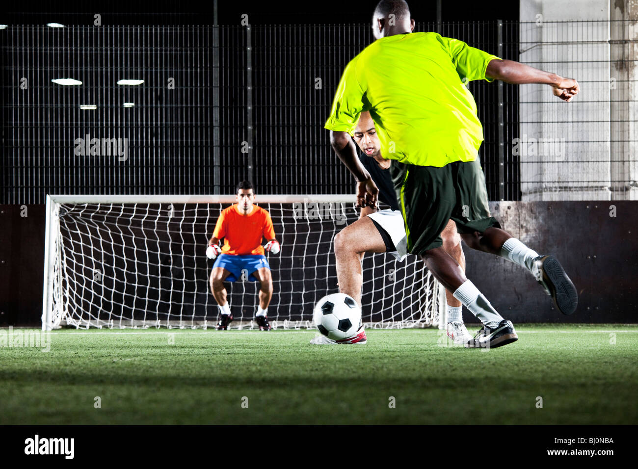 scene in street football match player defending goal Stock Photo - Alamy