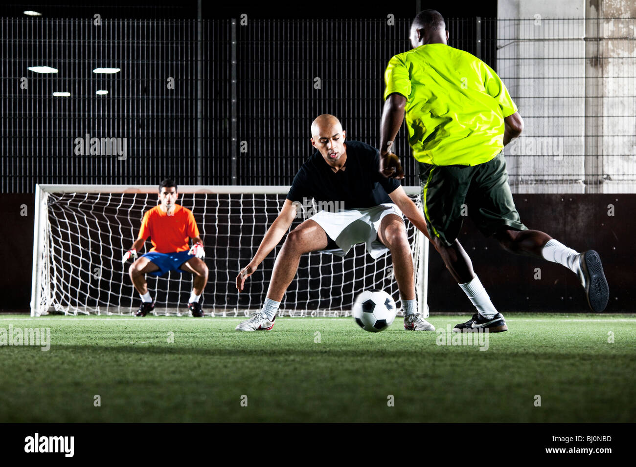 scene in street football match player defending goal Stock Photo - Alamy
