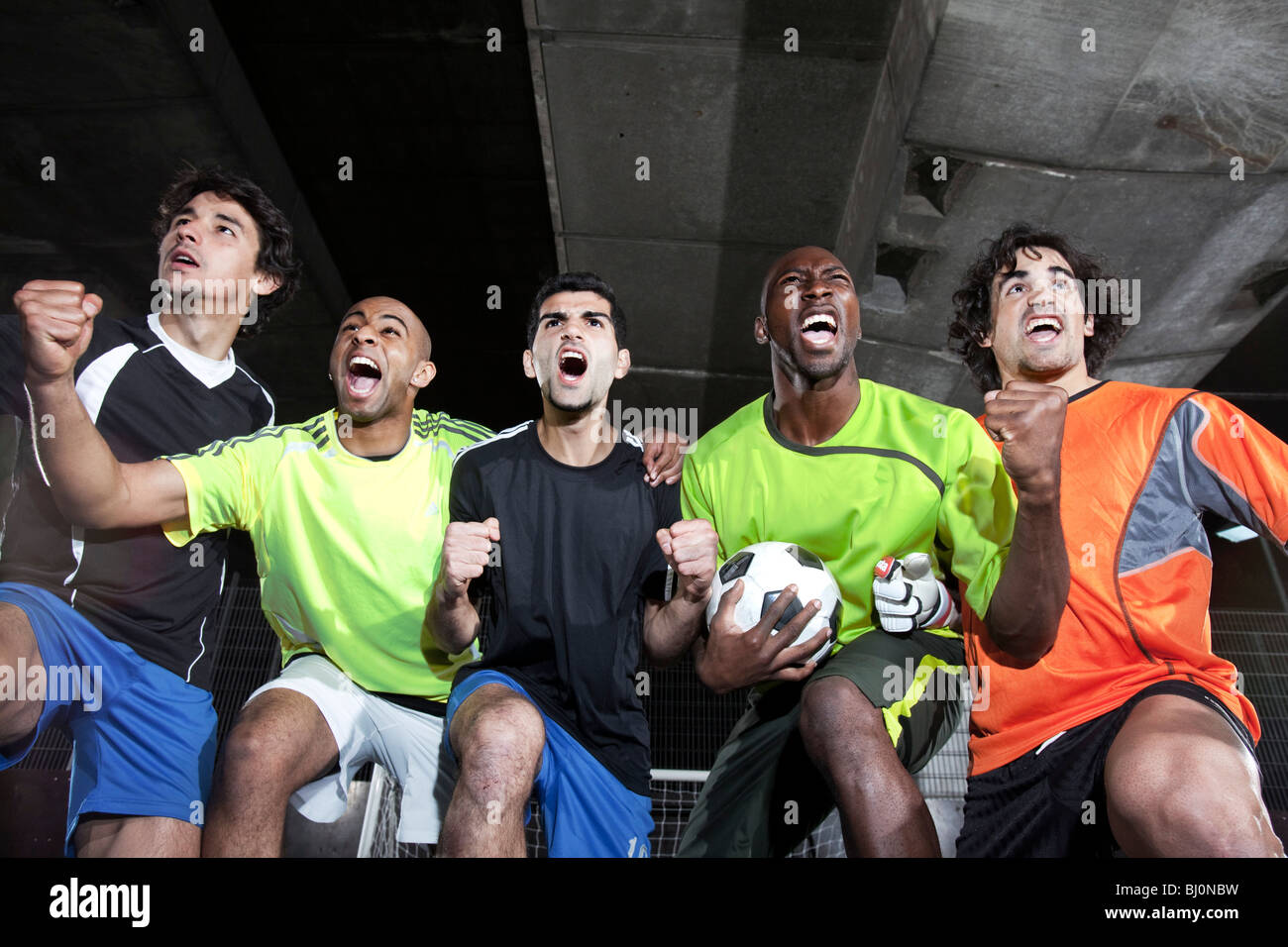 football players cheering Stock Photo - Alamy