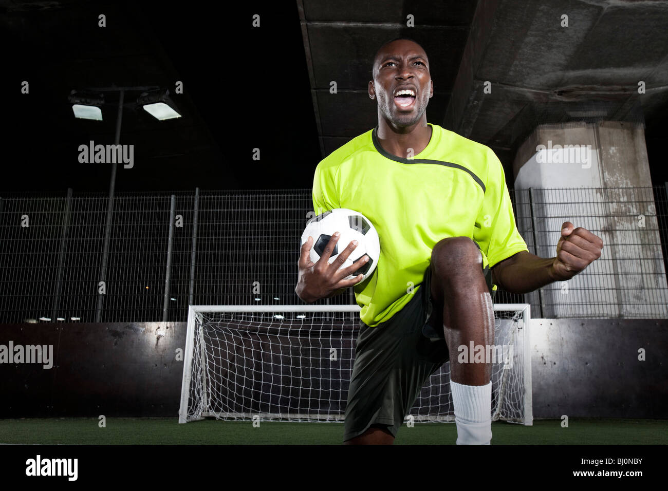 portrait of football player cheering Stock Photo - Alamy
