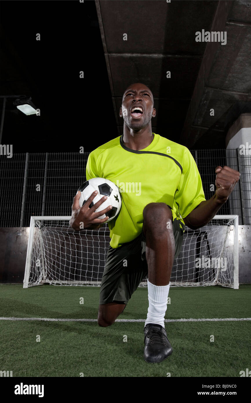 portrait of football player cheering Stock Photo - Alamy