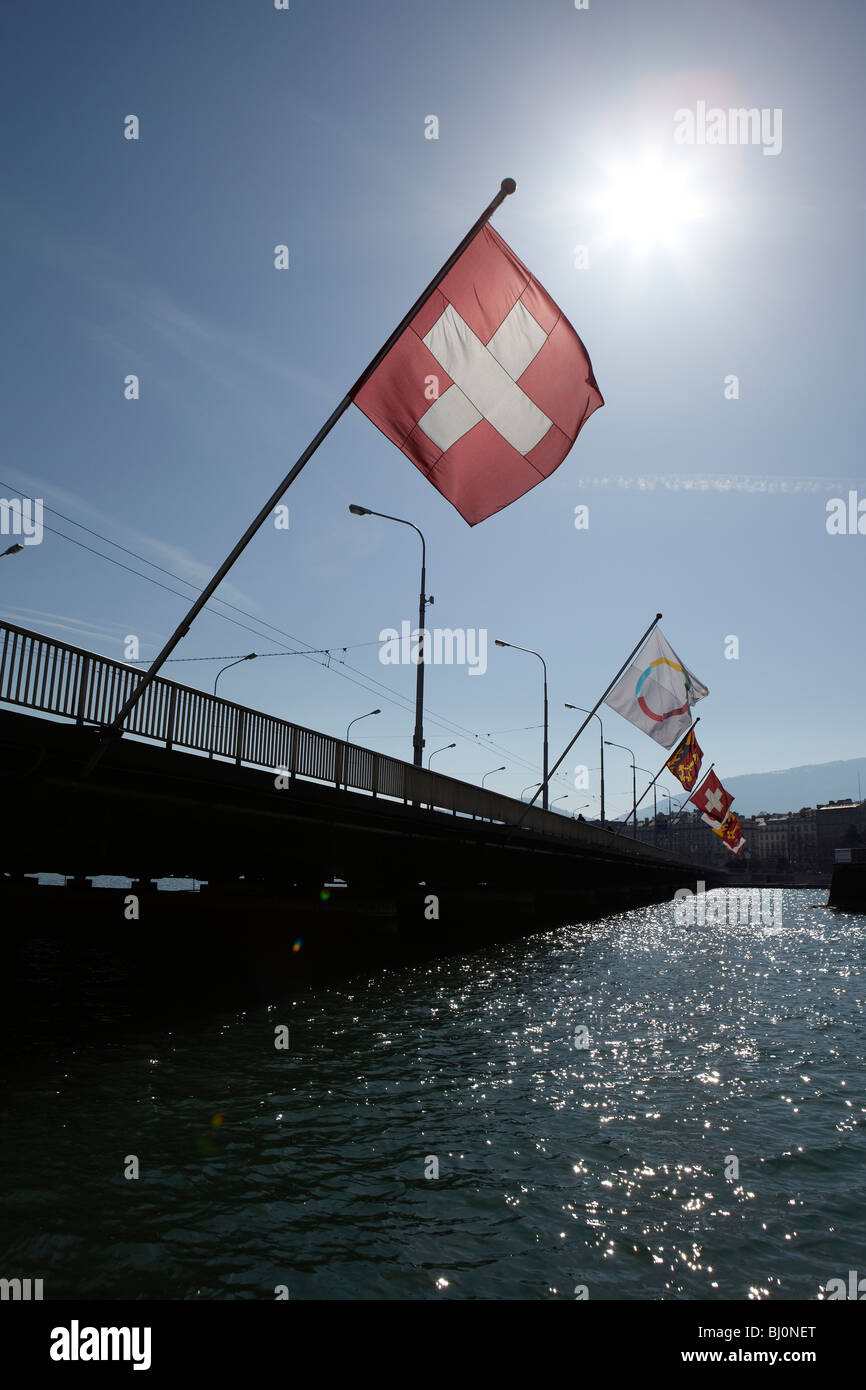 Swiss flag and the River Rhone near Lake Geneva, Switzerland Stock ...