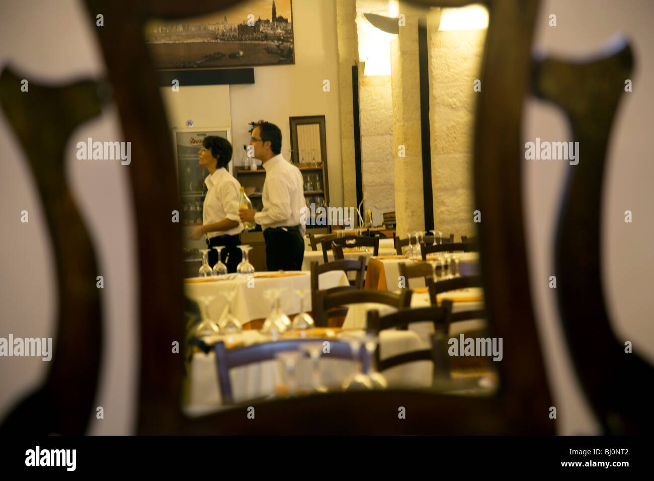 reflection of Italian restaurant in mirror Stock Photo - Alamy