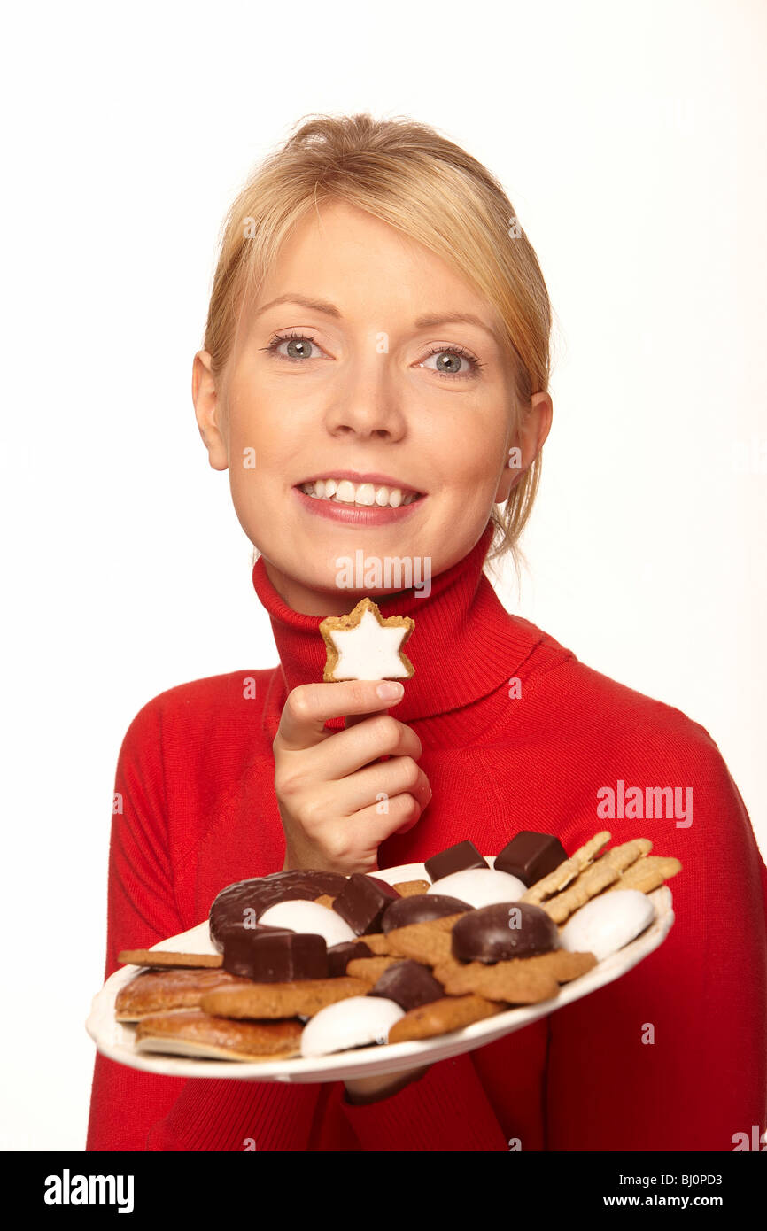 Woman eating ginger biscuit hi-res stock photography and images - Alamy