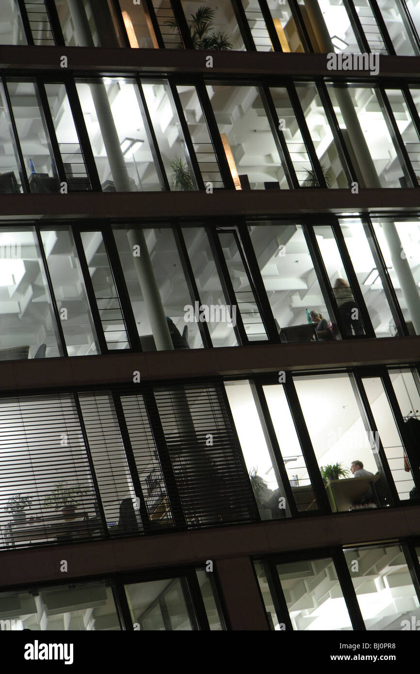 Employees in an office building in the evening, Berlin, Germany Stock ...