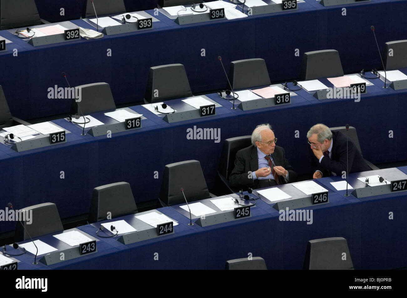 Two members of European Parliament talking during parliamentary session ...