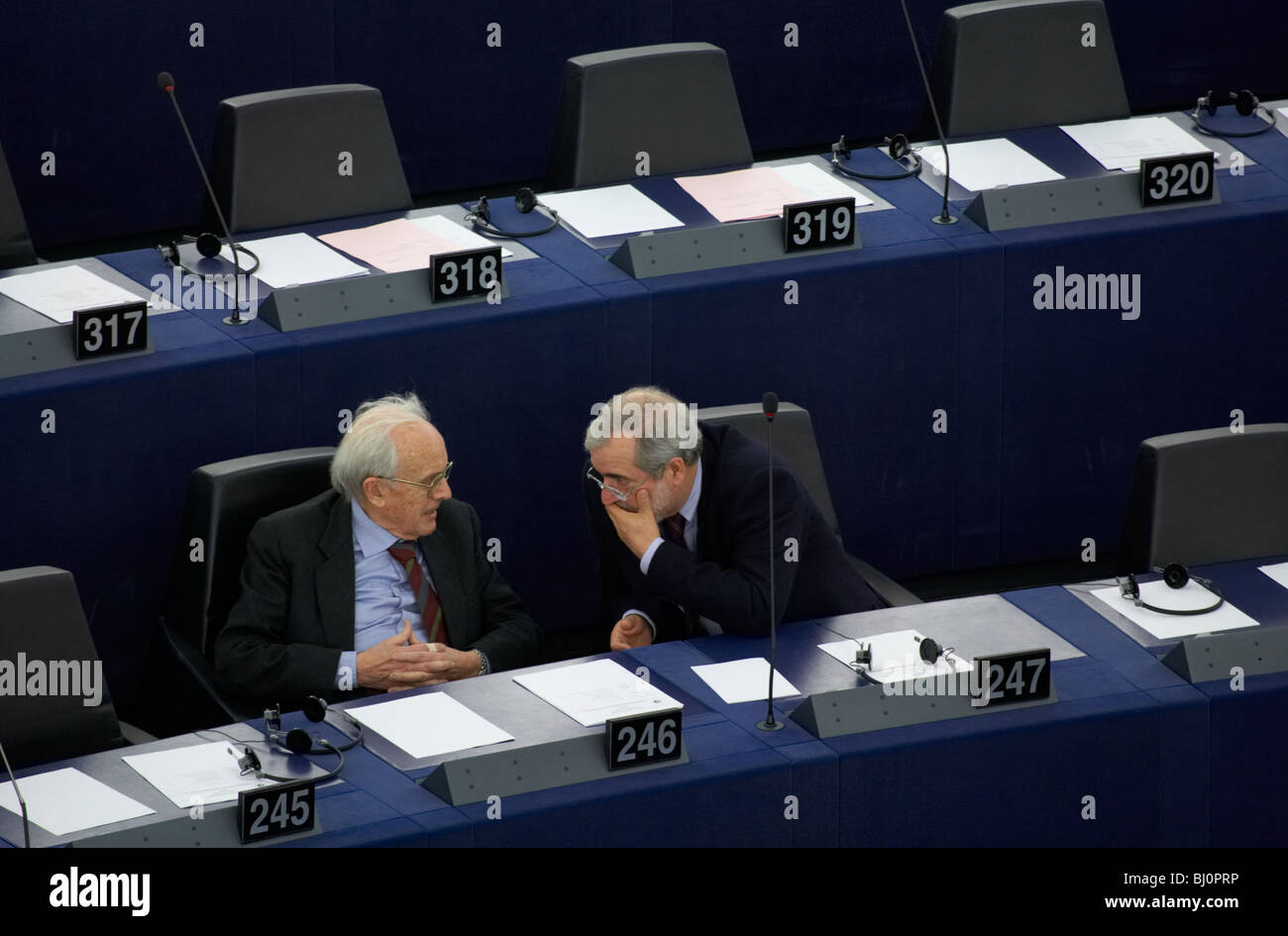 Two members of European Parliament talking during parliamentary session ...
