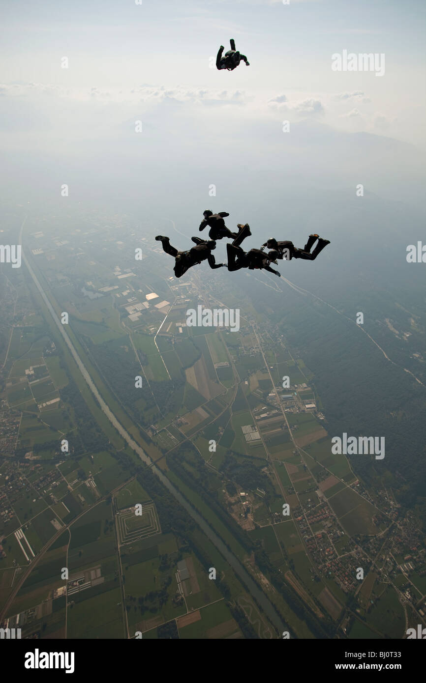 Formation skydive team turning points in the sky and get filmed by the ...