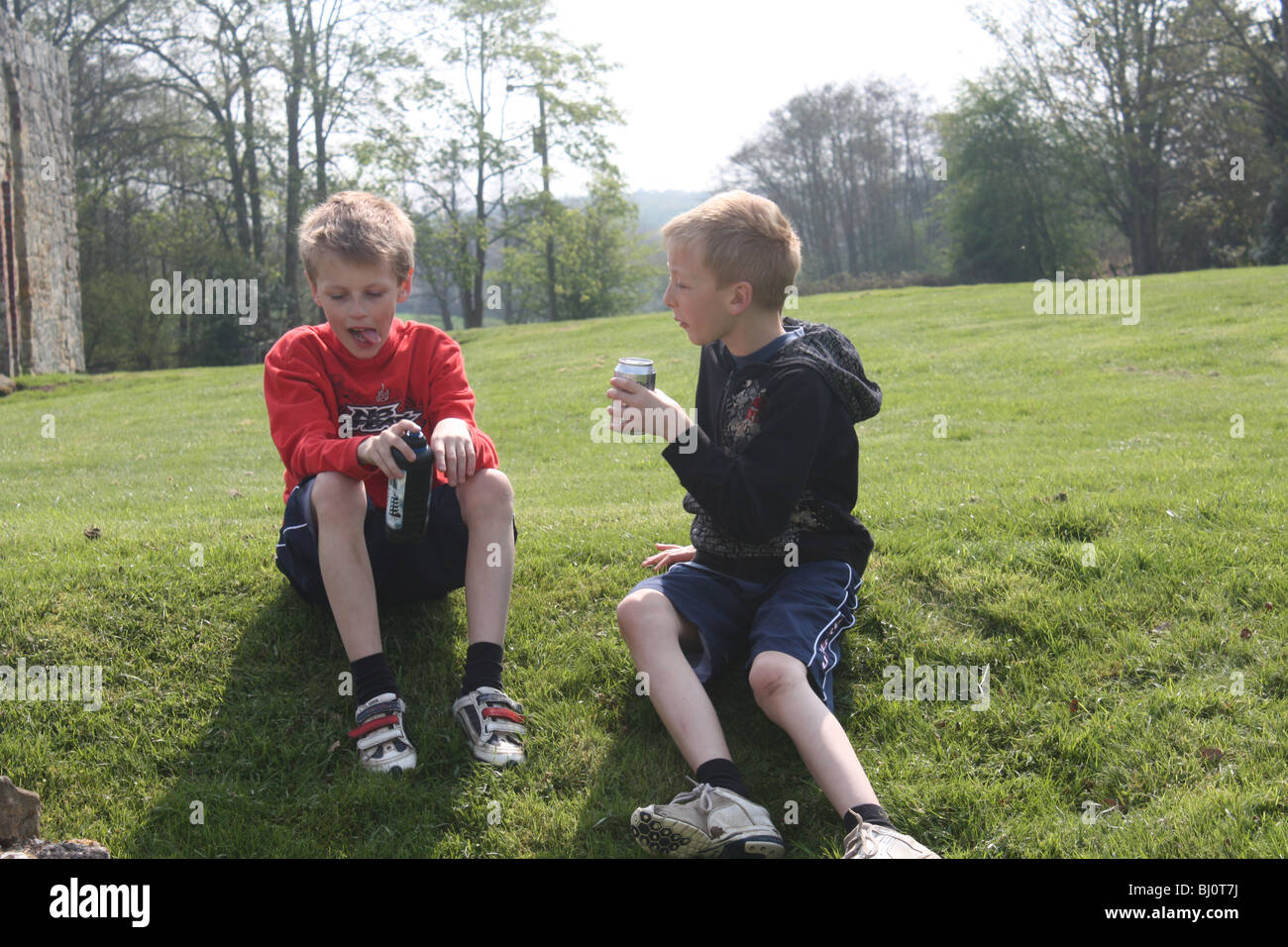 Children having a rest from playing Stock Photo - Alamy