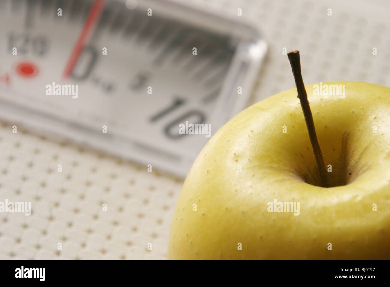 Apple with balance Stock Photo - Alamy