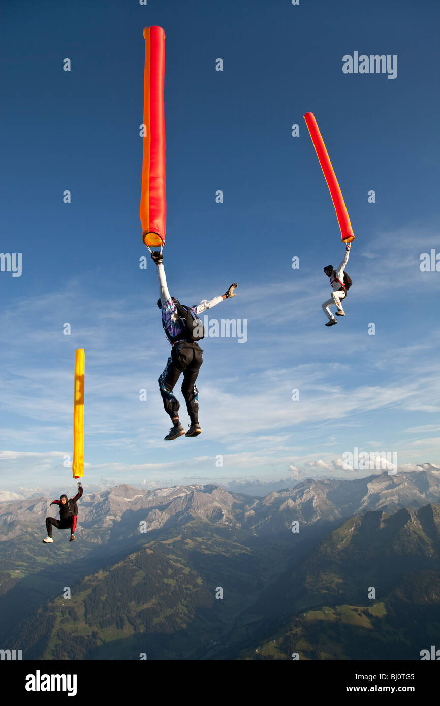 Skydivers with colorful tubes flying around each. The Freeflyers are ...