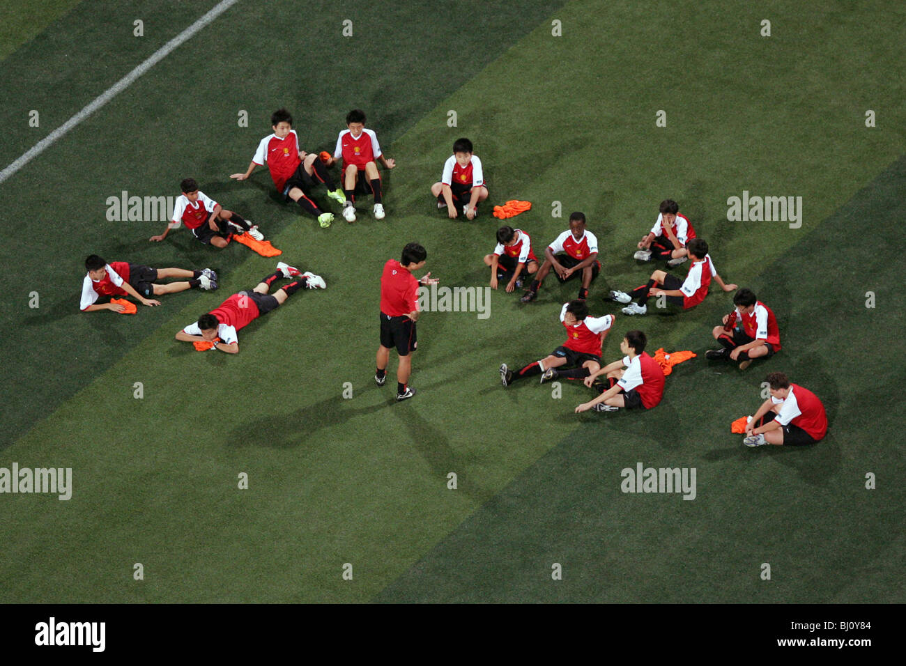 Football players and coach hi-res stock photography and images - Alamy