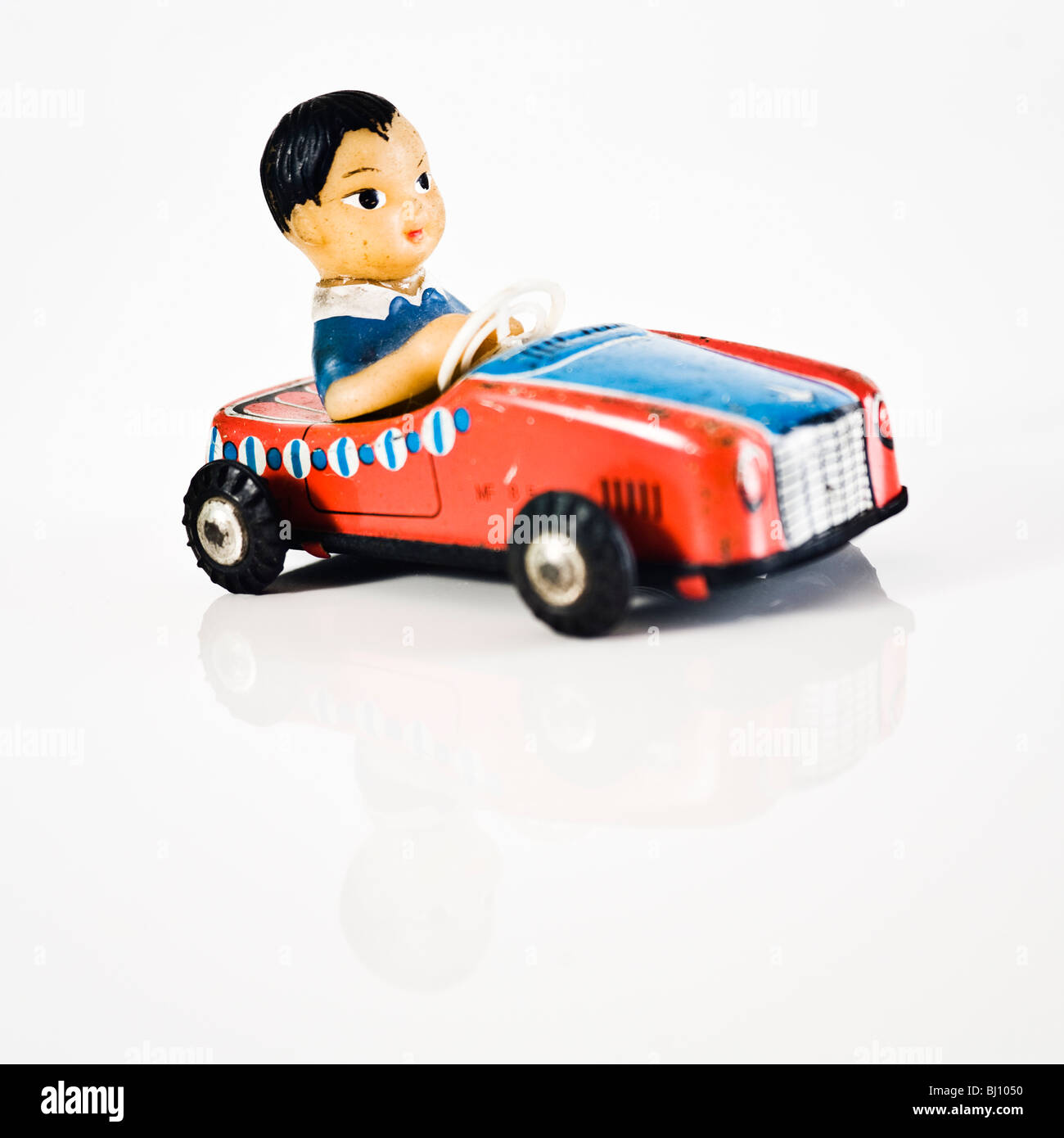 Old tin toy model car Cut Out Stock Images & Pictures - Alamy