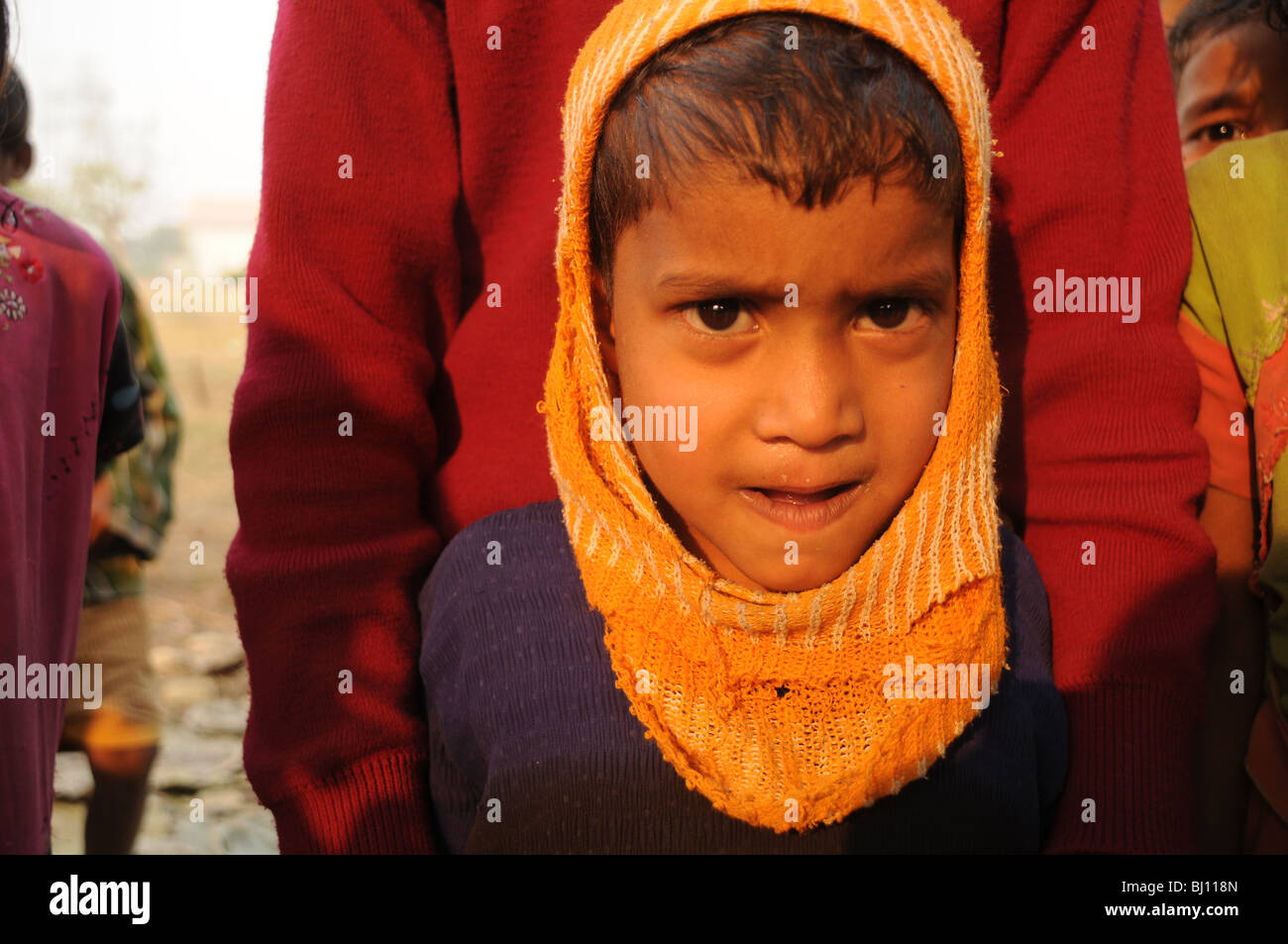 young boy with orange hat Stock Photo - Alamy