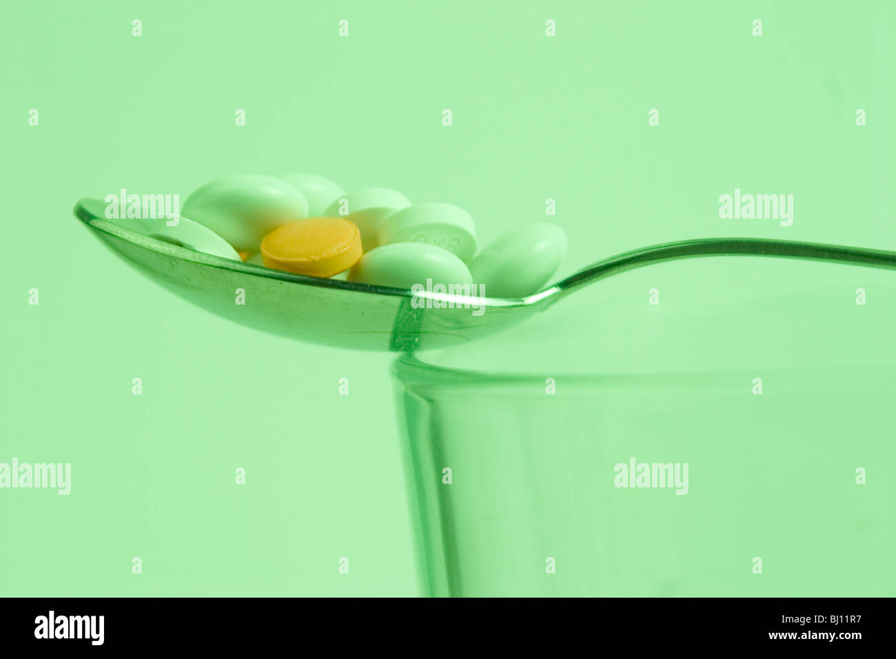 tablets on a spoon Stock Photo - Alamy