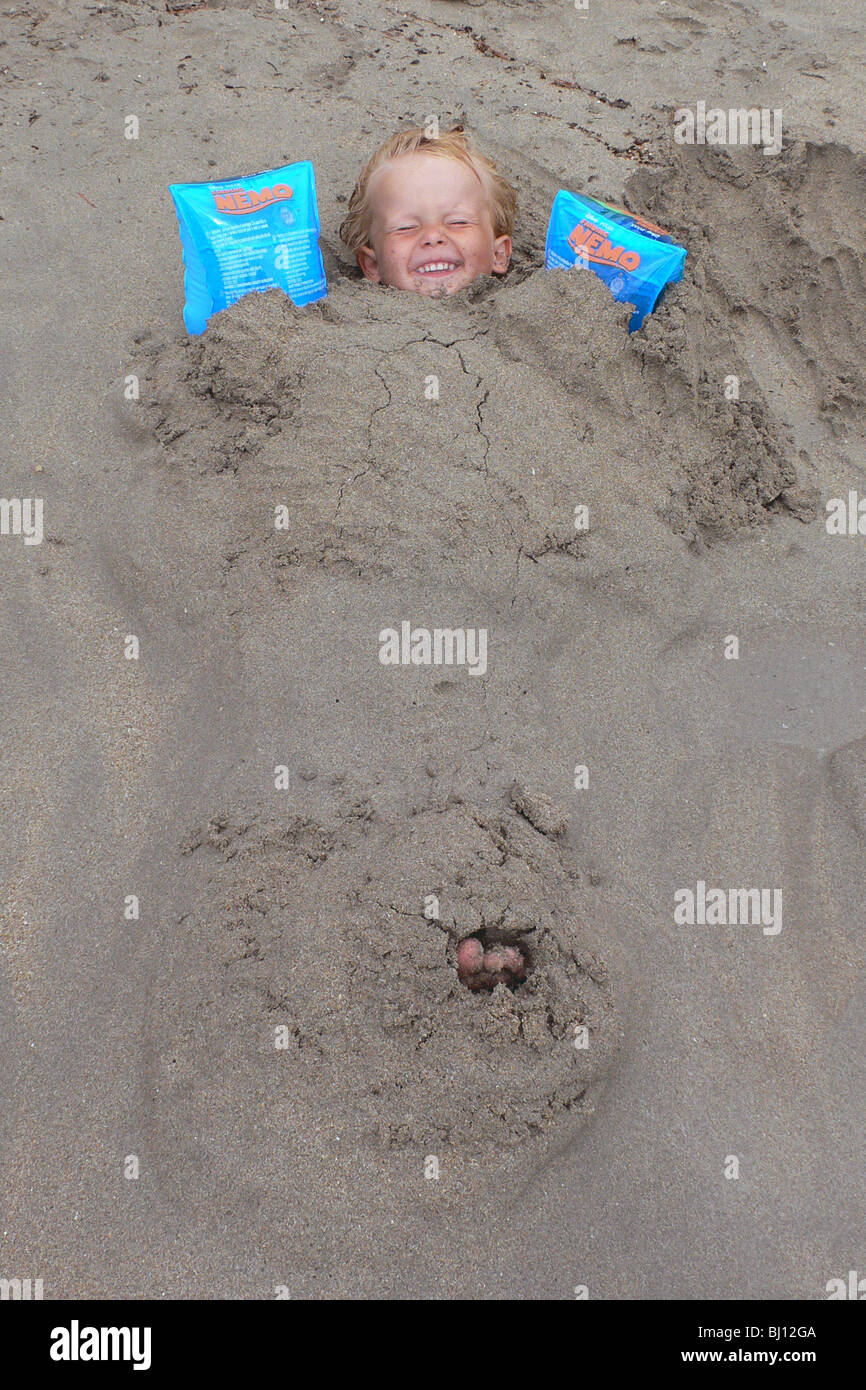 Human in beach sand hi-res stock photography and images - Alamy