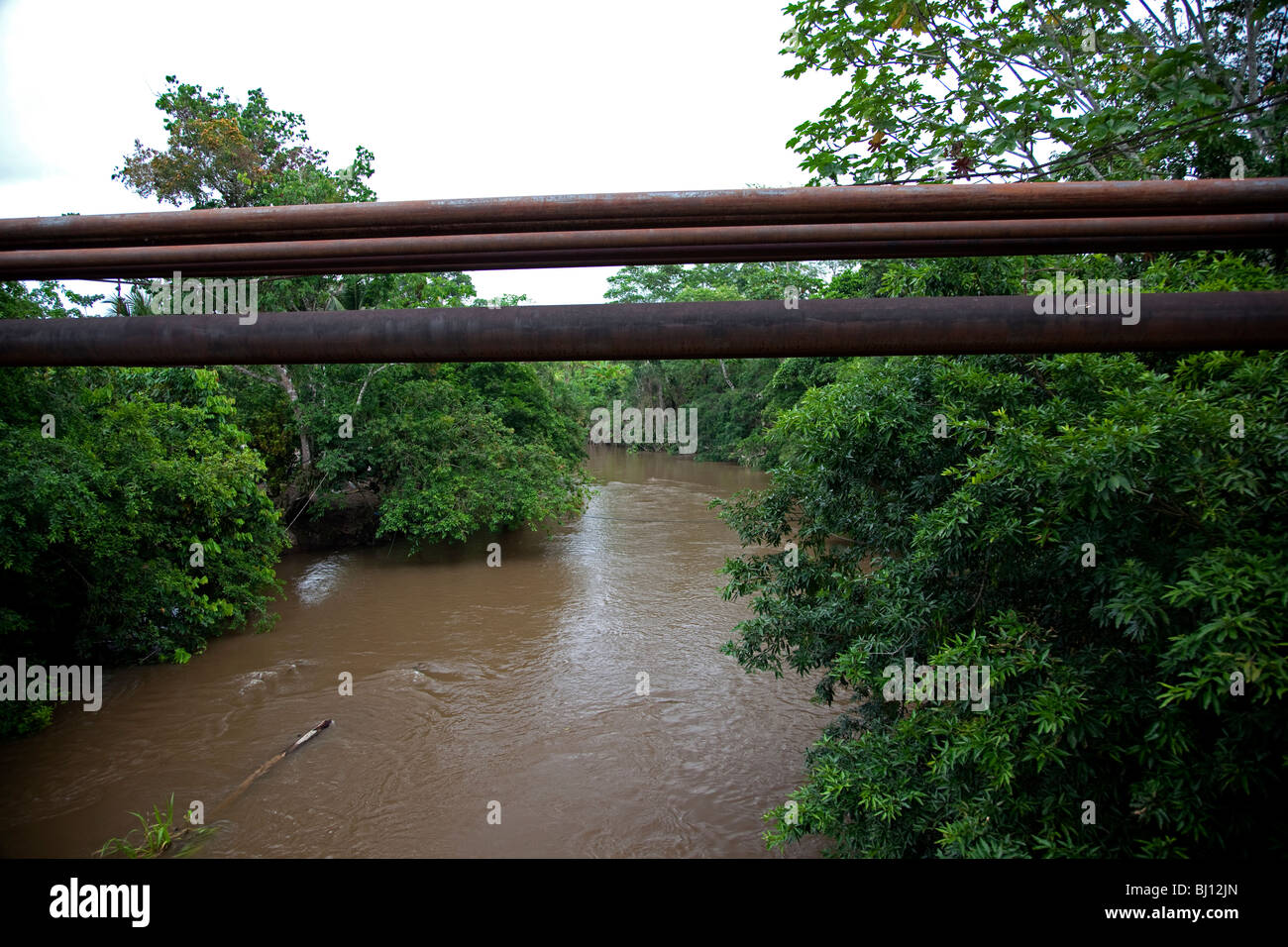 Oil waste pits and pipes in the Ecuadorian Amazon created by Texaco Oil ...