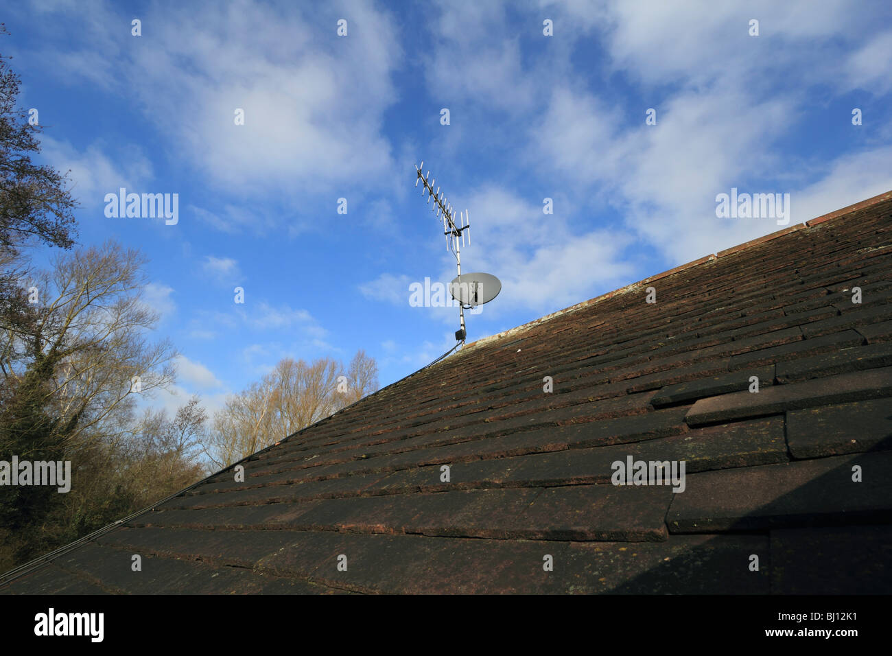 A satellite digital television arial on a roof Stock Photo - Alamy