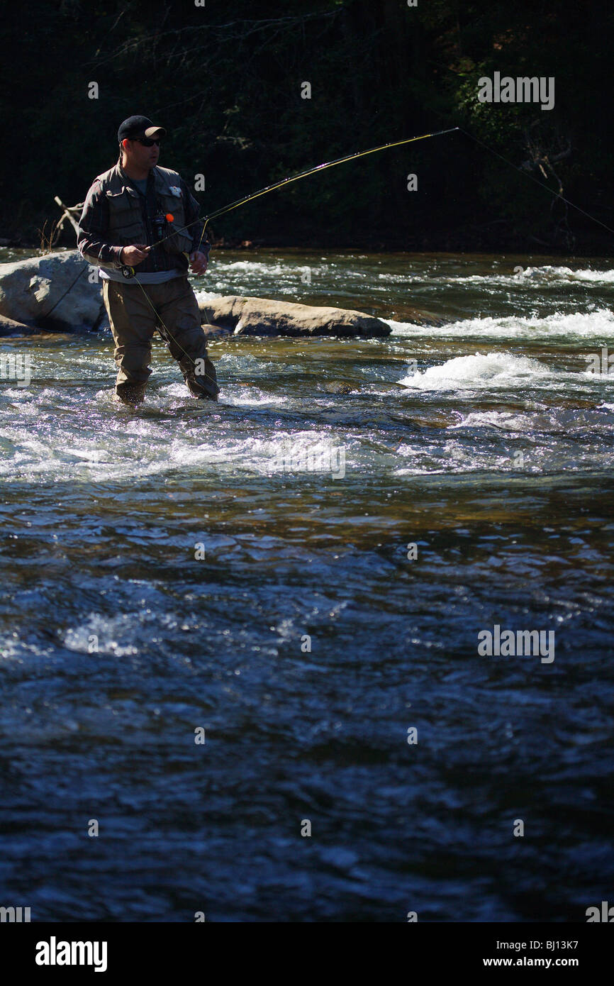FLY FISHERMAN FIGHTING FAST RUNNING RIVER IN SEARCH OF TROUT TOCCOA ...