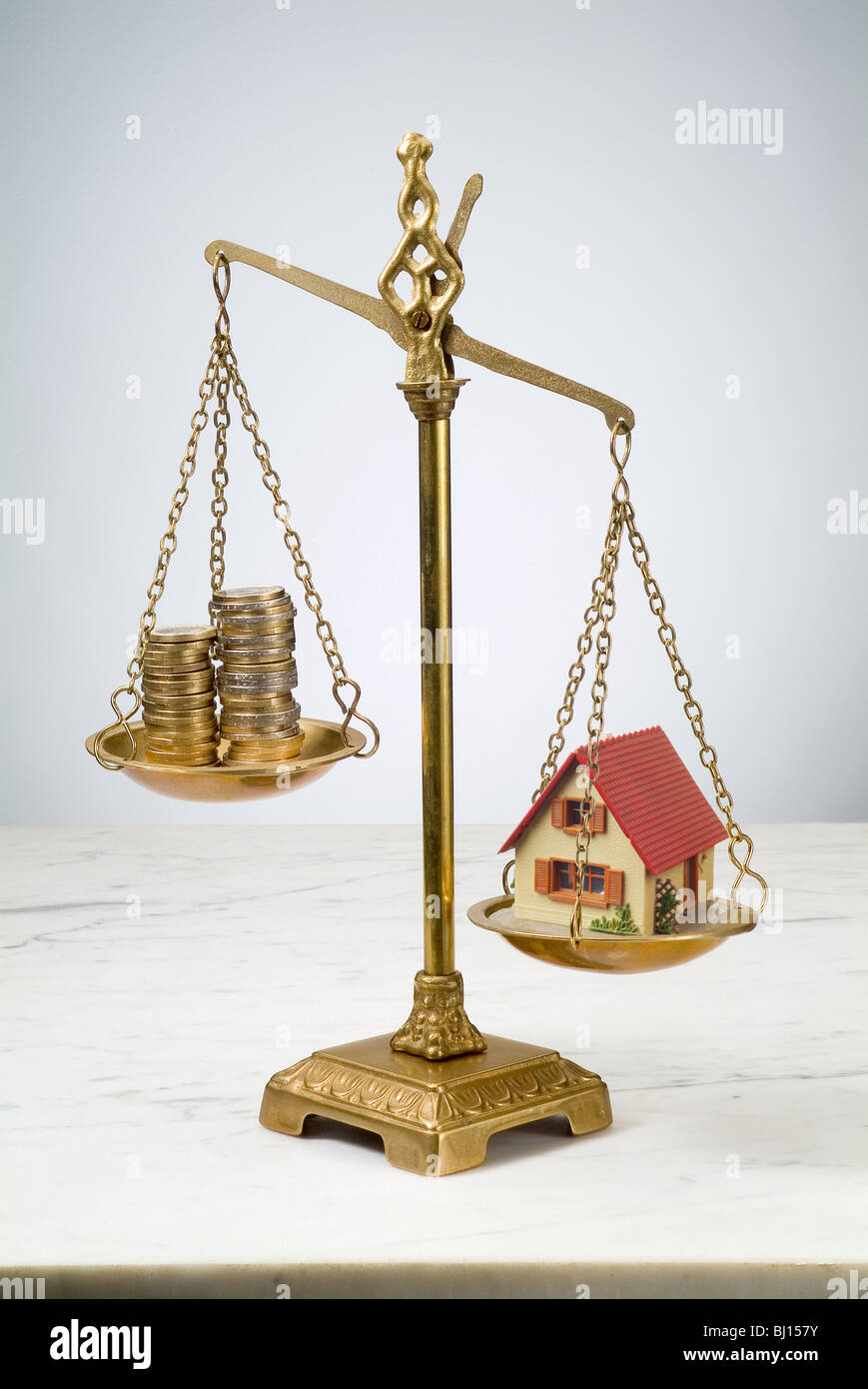 Balancing scale and house hi-res stock photography and images - Alamy