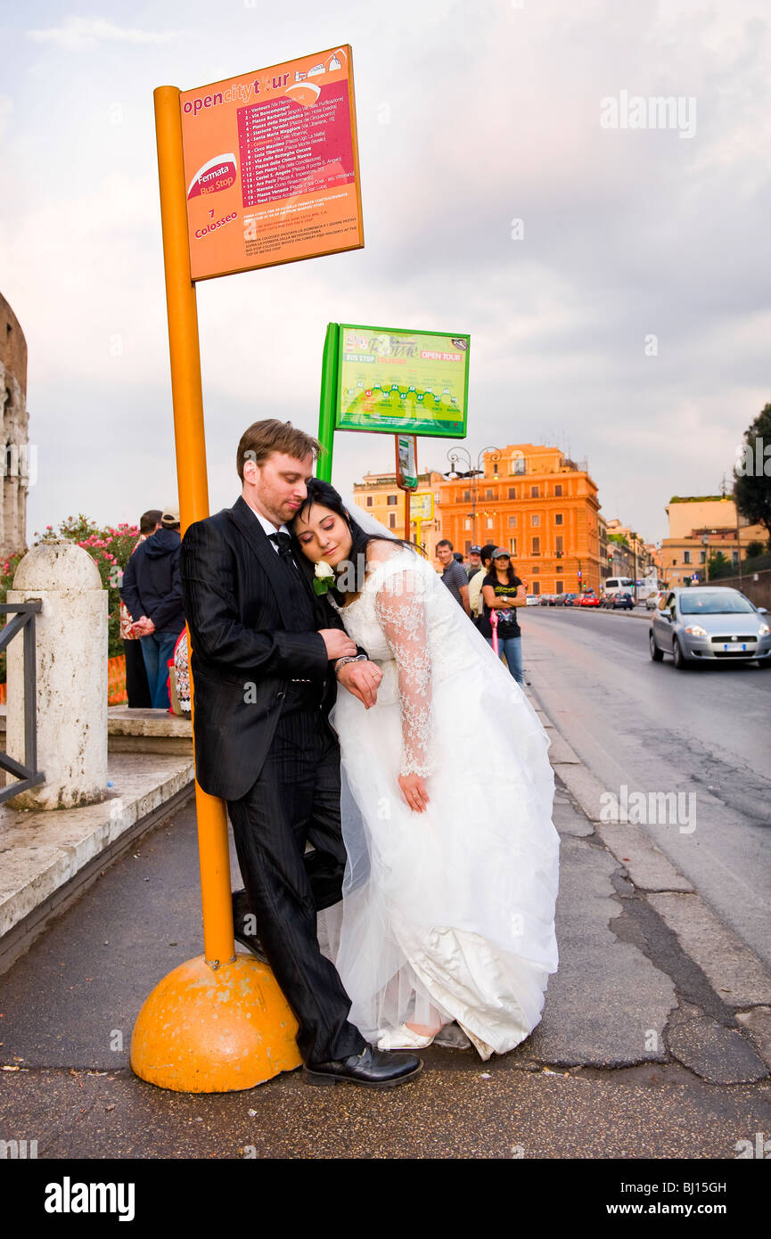 Bride and groom standing at bus stops Stock Photo - Alamy