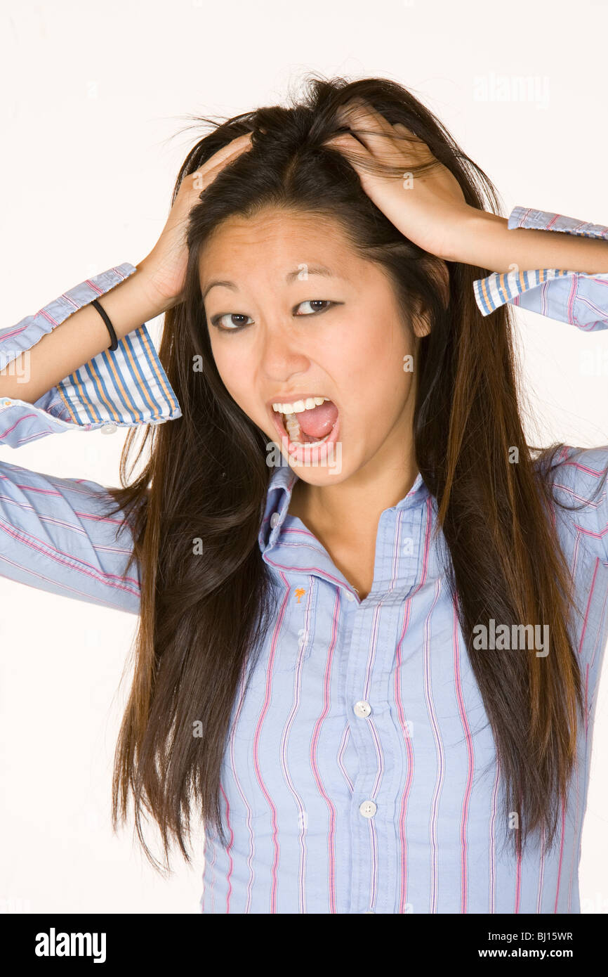 Asian woman showing signs of stress Stock Photo - Alamy