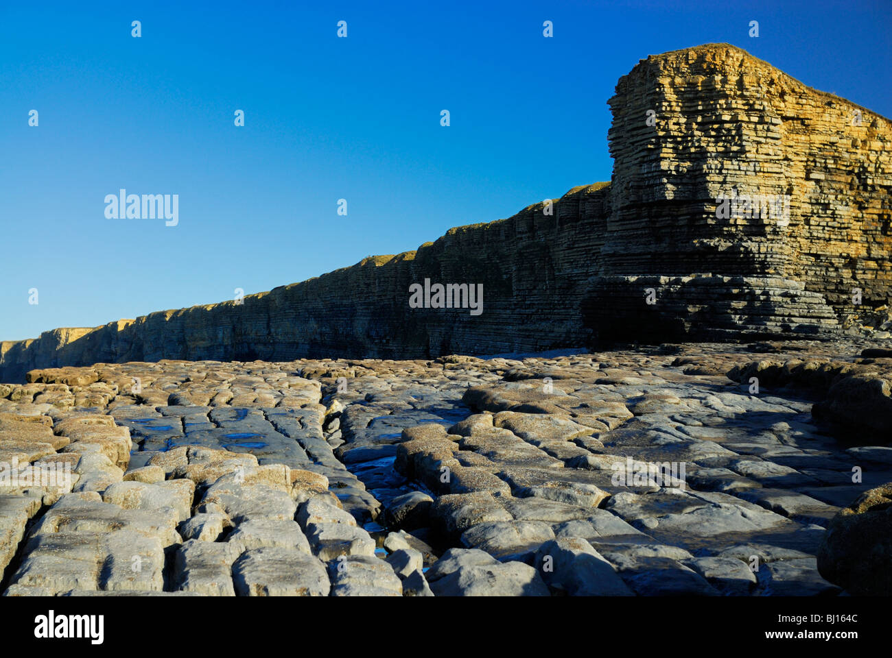 Cliffs at Nash point in South Wales viewed from the rocky Limestone and ...