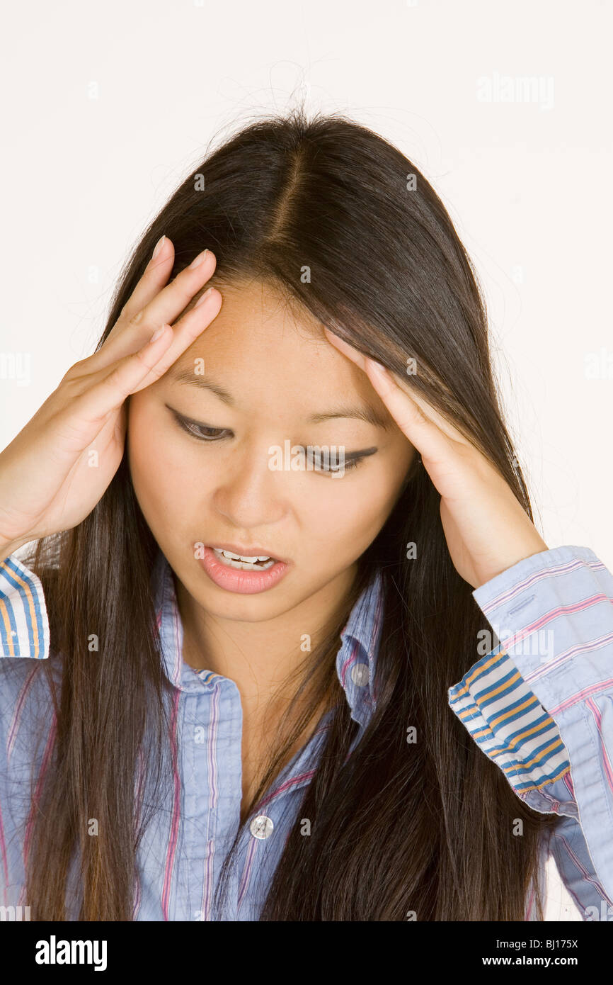 Asian woman showing signs of stress Stock Photo - Alamy